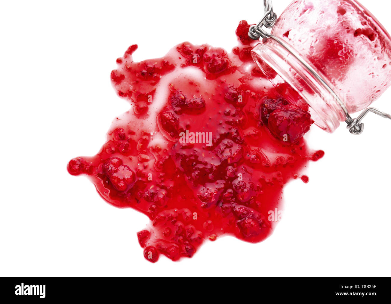 Glass jar and spilled raspberry jam on white background Stock Photo - Alamy