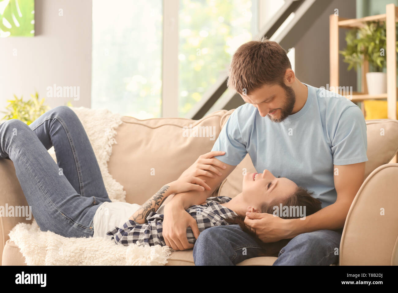 Happy lovely couple resting at home Stock Photo - Alamy