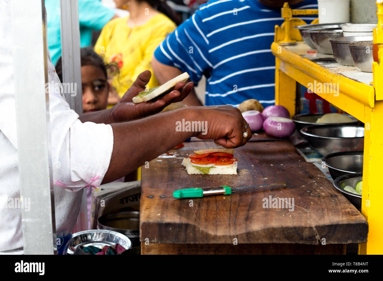 Roadside sandwich stall maker with children looking on Stock Photo - Alamy
