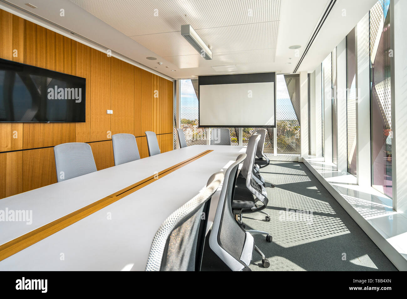 Contemporary office meeting room with a projection screen Stock Photo ...