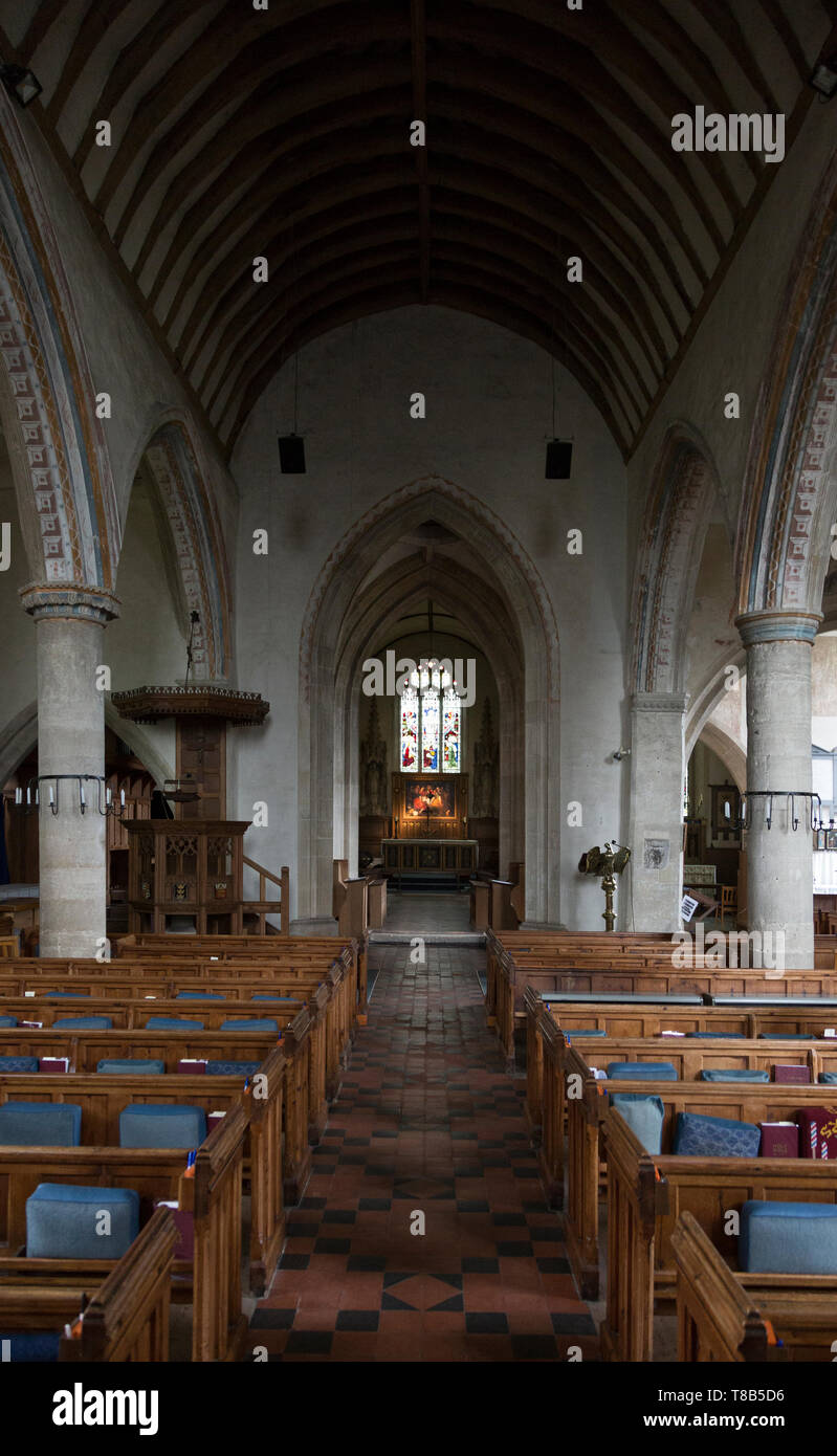 View down the nave to chancel, altar and east window inside the church ...
