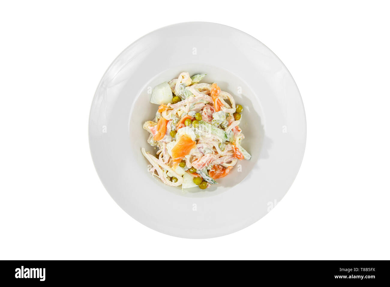 Russian salad with fish salmon, cucumber, peas, eggs, mayonnaise on ...