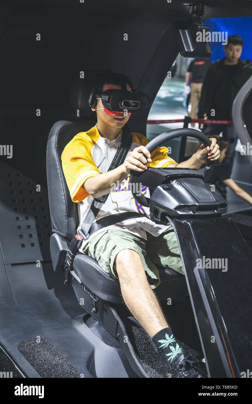 guangzhou,china - Nov,18,2018:people playing the vr race car game in ...