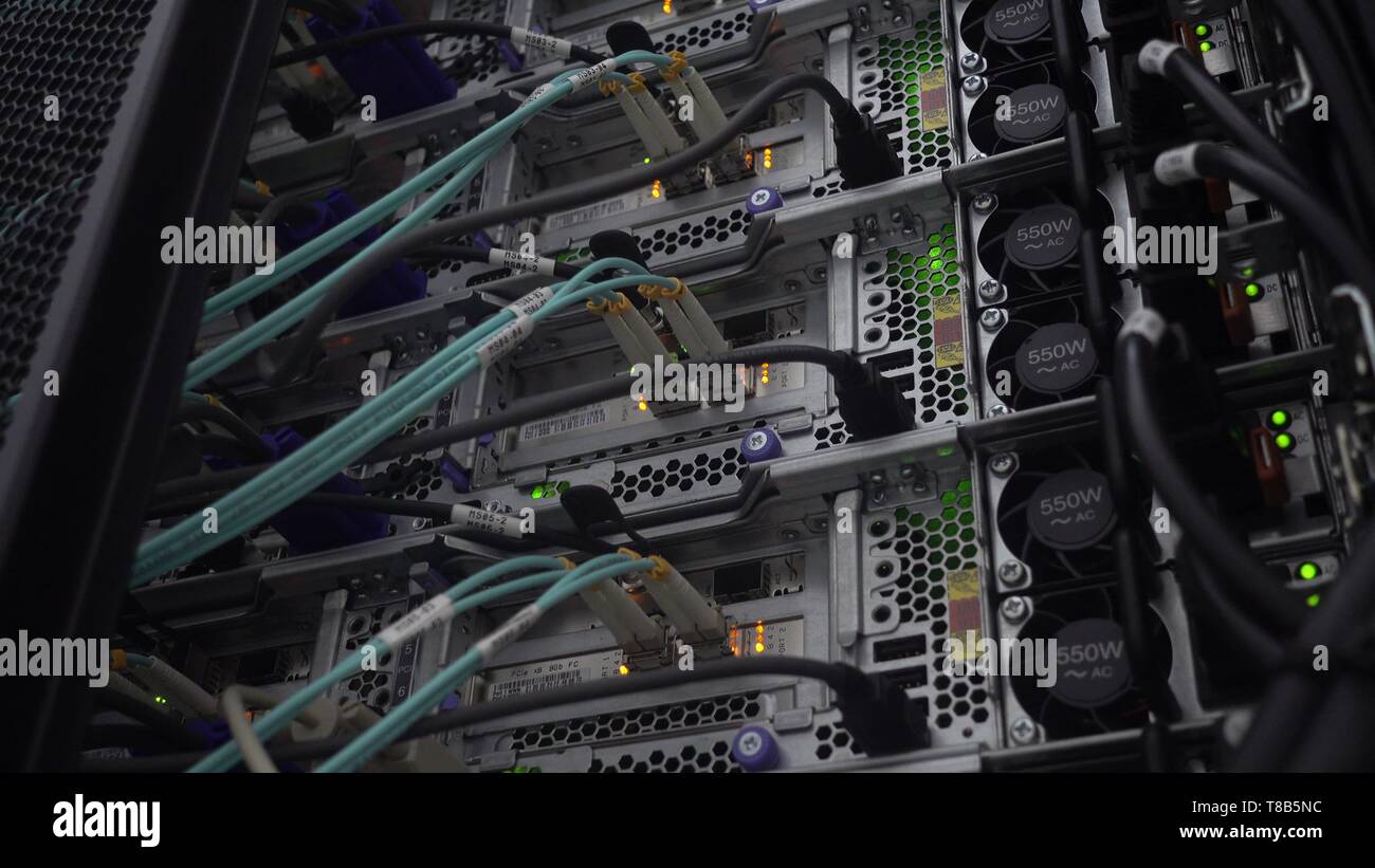 Running server. Optical cable close-up. Network devices technology ...