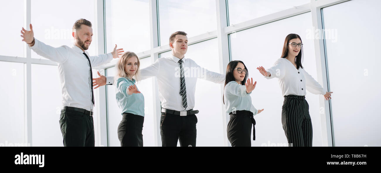 successful business team standing in a spacious office. the concept of ...