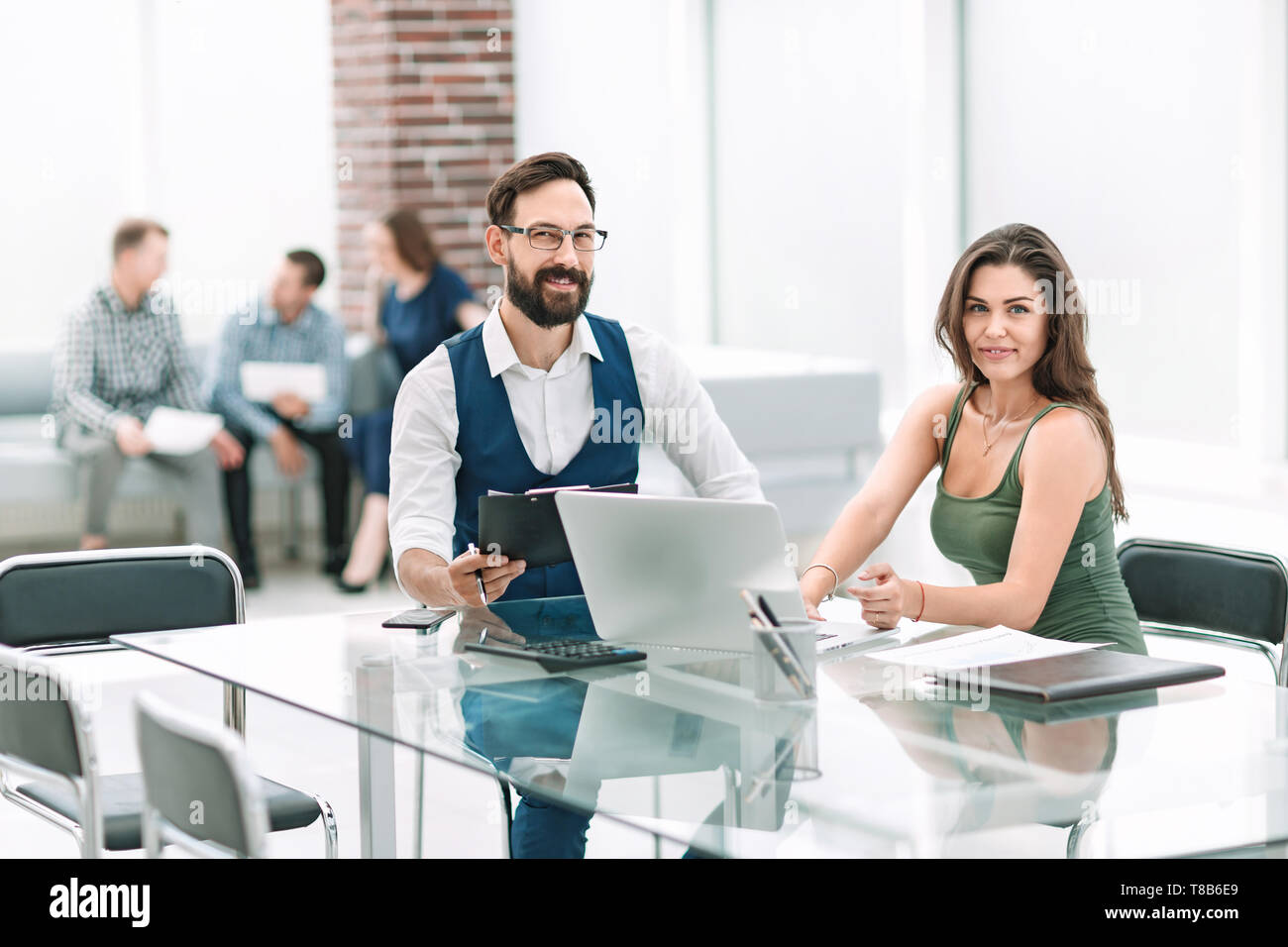 business colleagues sitting at their Desk in the office.the concept of ...