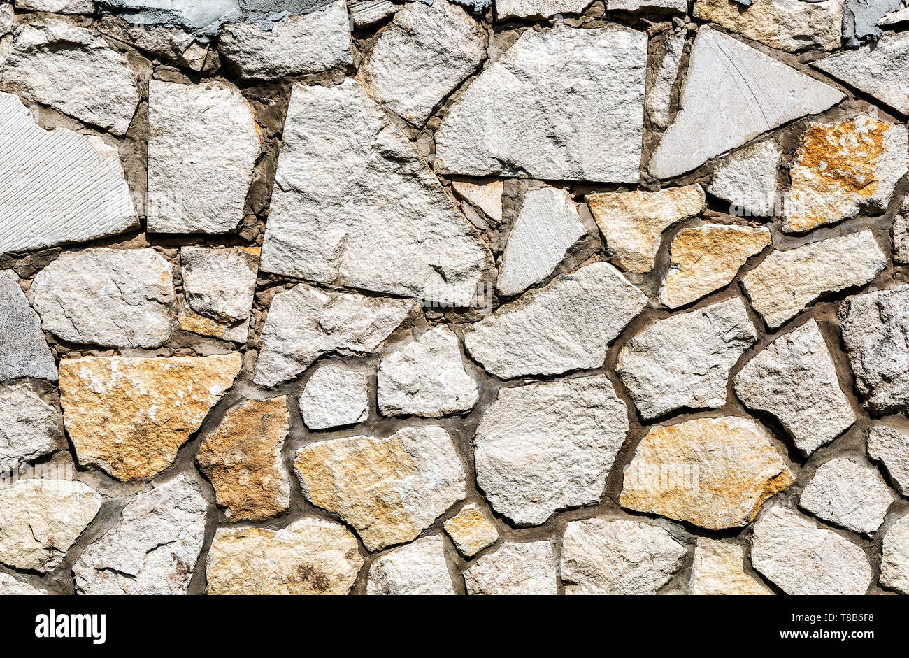 Weathered grey stone wall as creative background texture. Natural ...