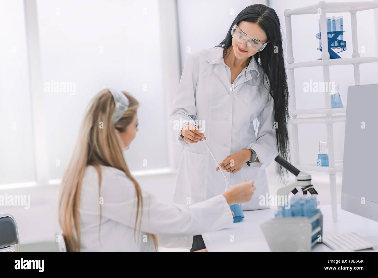 Two scientists conducting science experiment hi-res stock photography ...