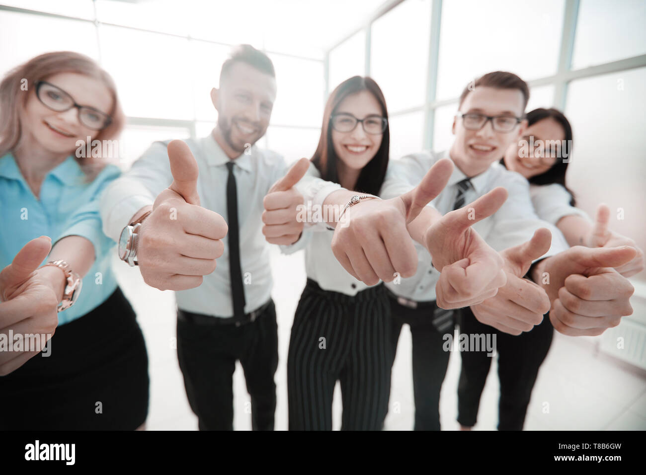 close up. business team showing their thumbs up. concept of success ...