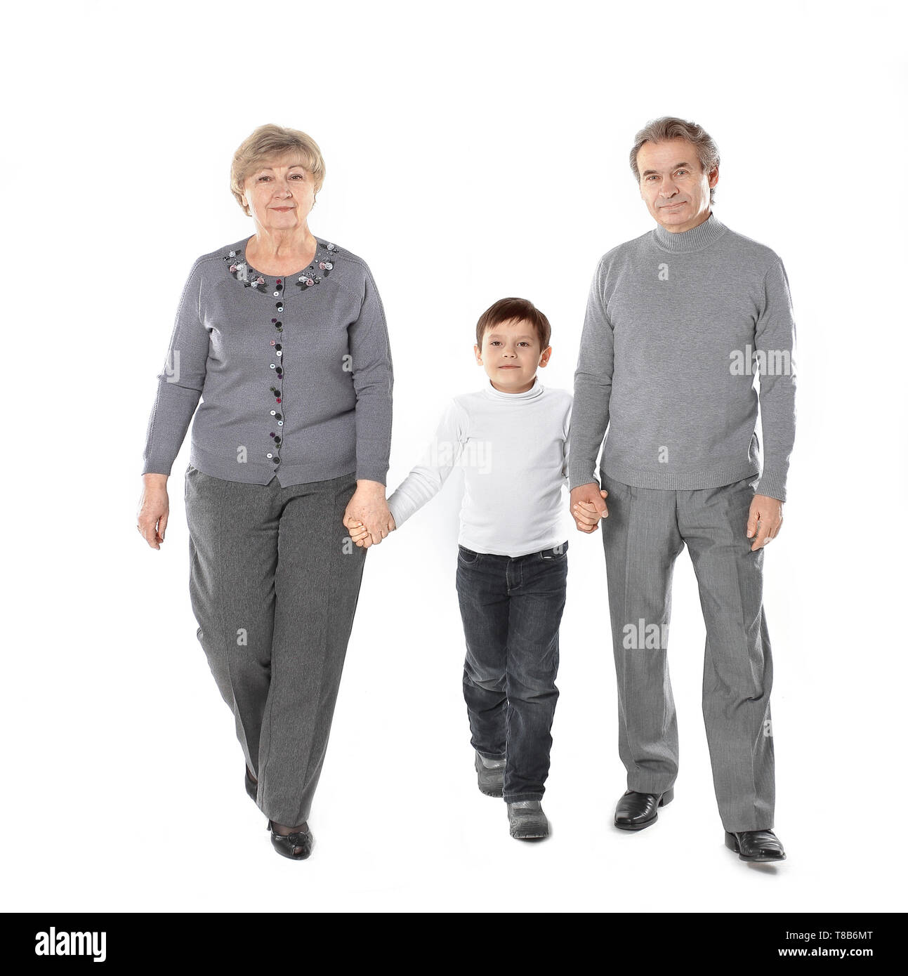 grandma and grandpa go with her grandson.isolated on white background ...
