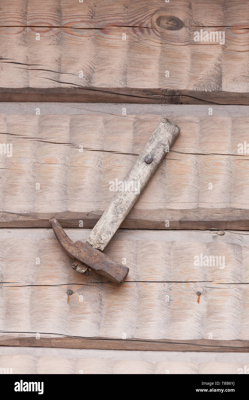 Old used tool decoration in wooden wall Stock Photo - Alamy