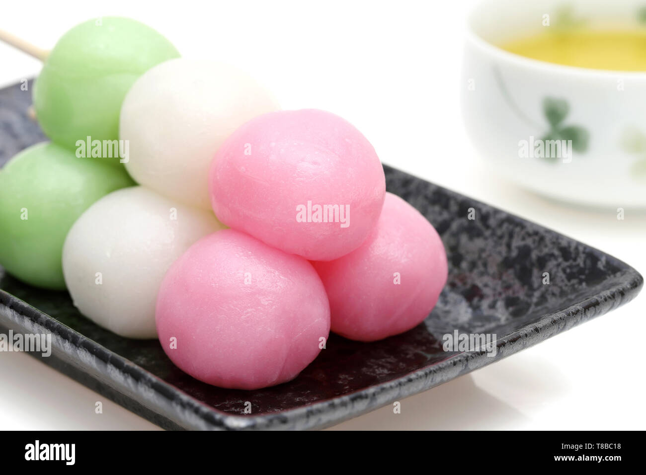 Japanese traditional confectionery Sanshoku Dango on white background ...