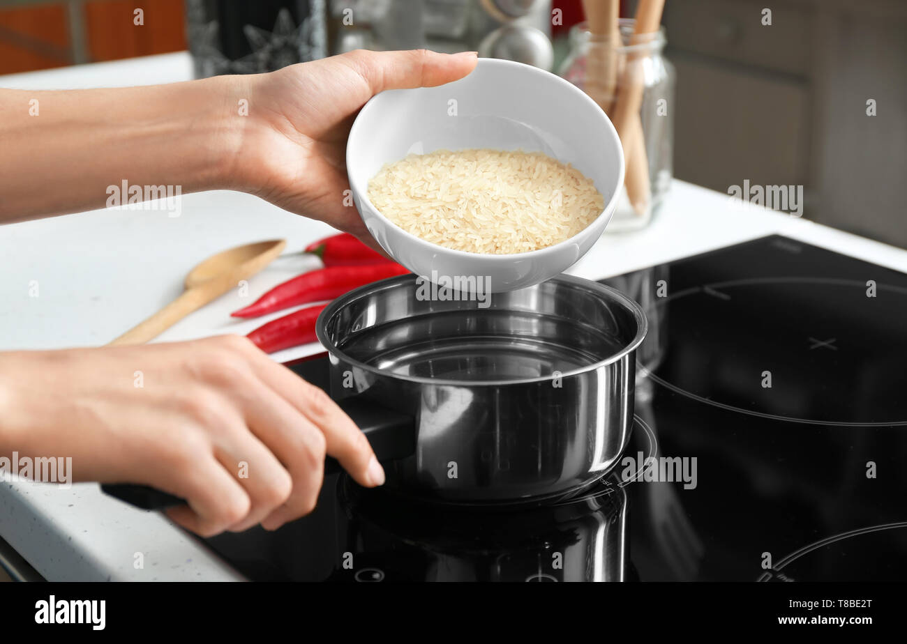 Rice boiling in saucepan hi-res stock photography and images - Alamy