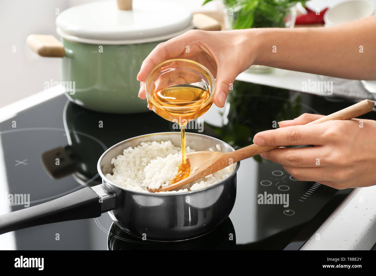 Woman adding oil hi-res stock photography and images - Alamy