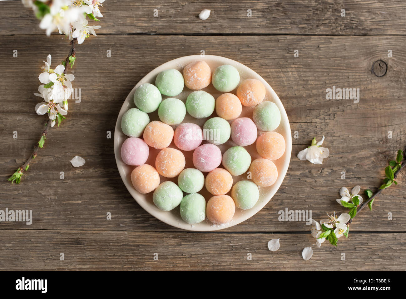 Mini Mochi - traditional japanese dessert on wooden background, top ...