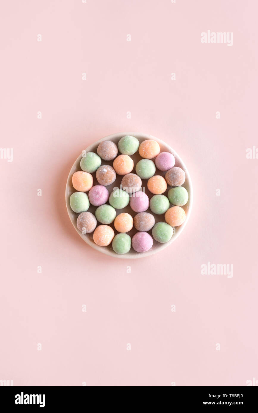 Mini Mochi - traditional japanese dessert on pink pastel background ...