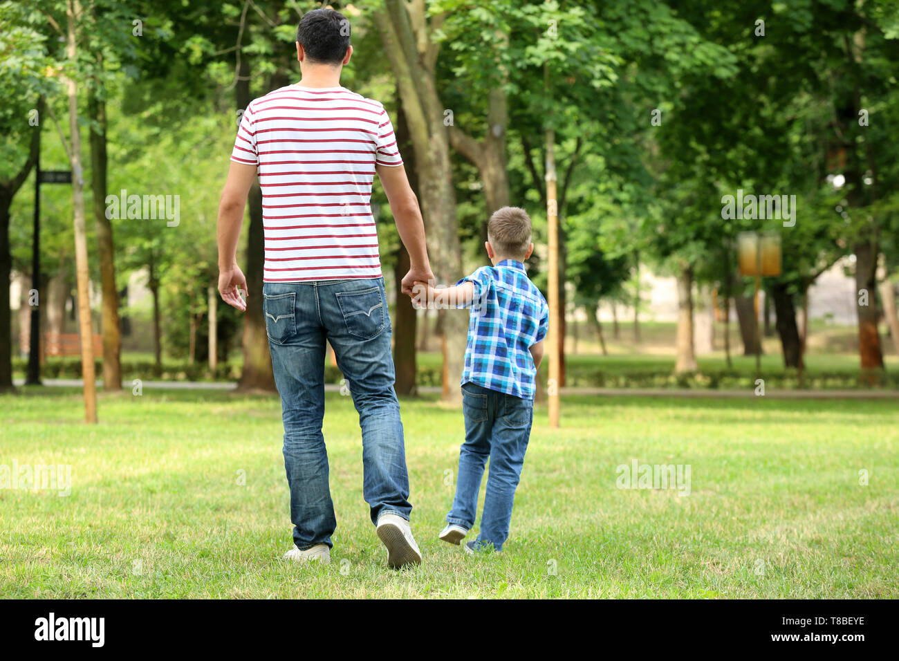 Little boy and his father walking outdoors Stock Photo - Alamy