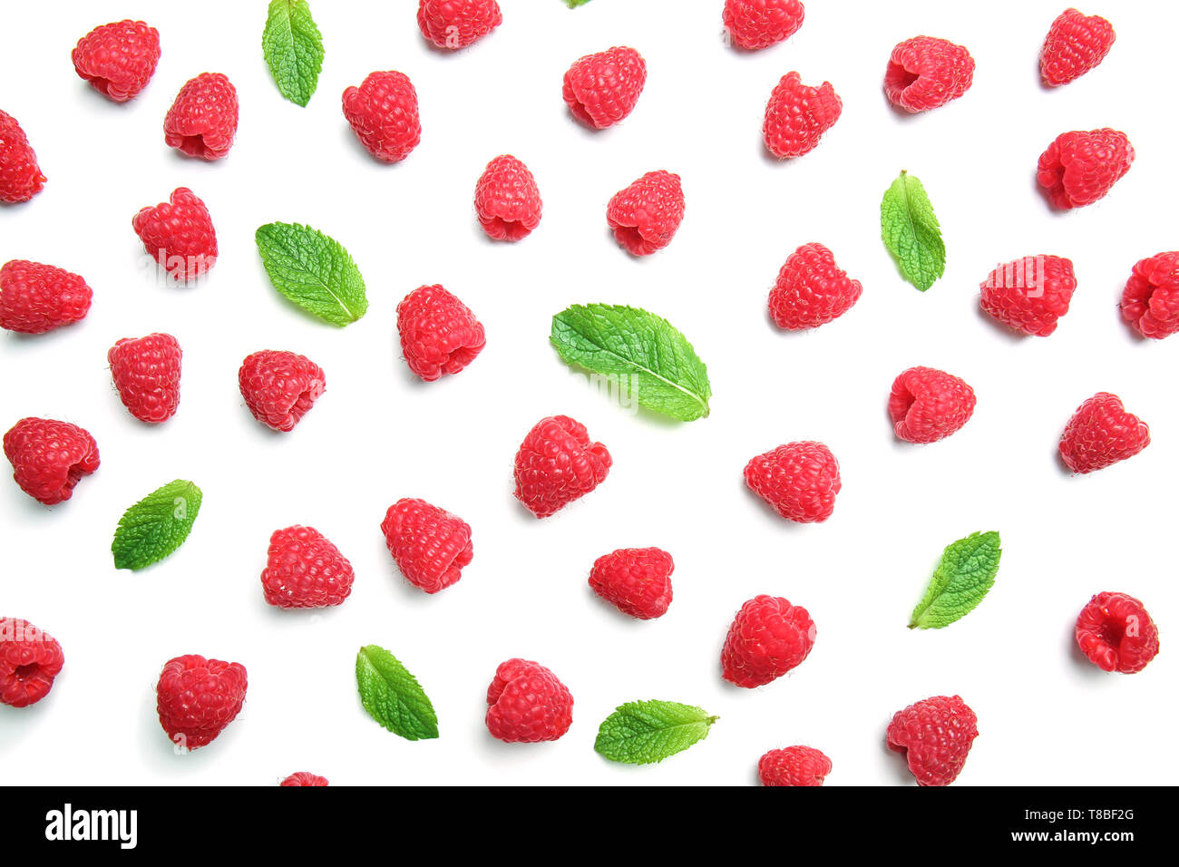 Fresh ripe raspberries with mint leaves on white background Stock Photo ...