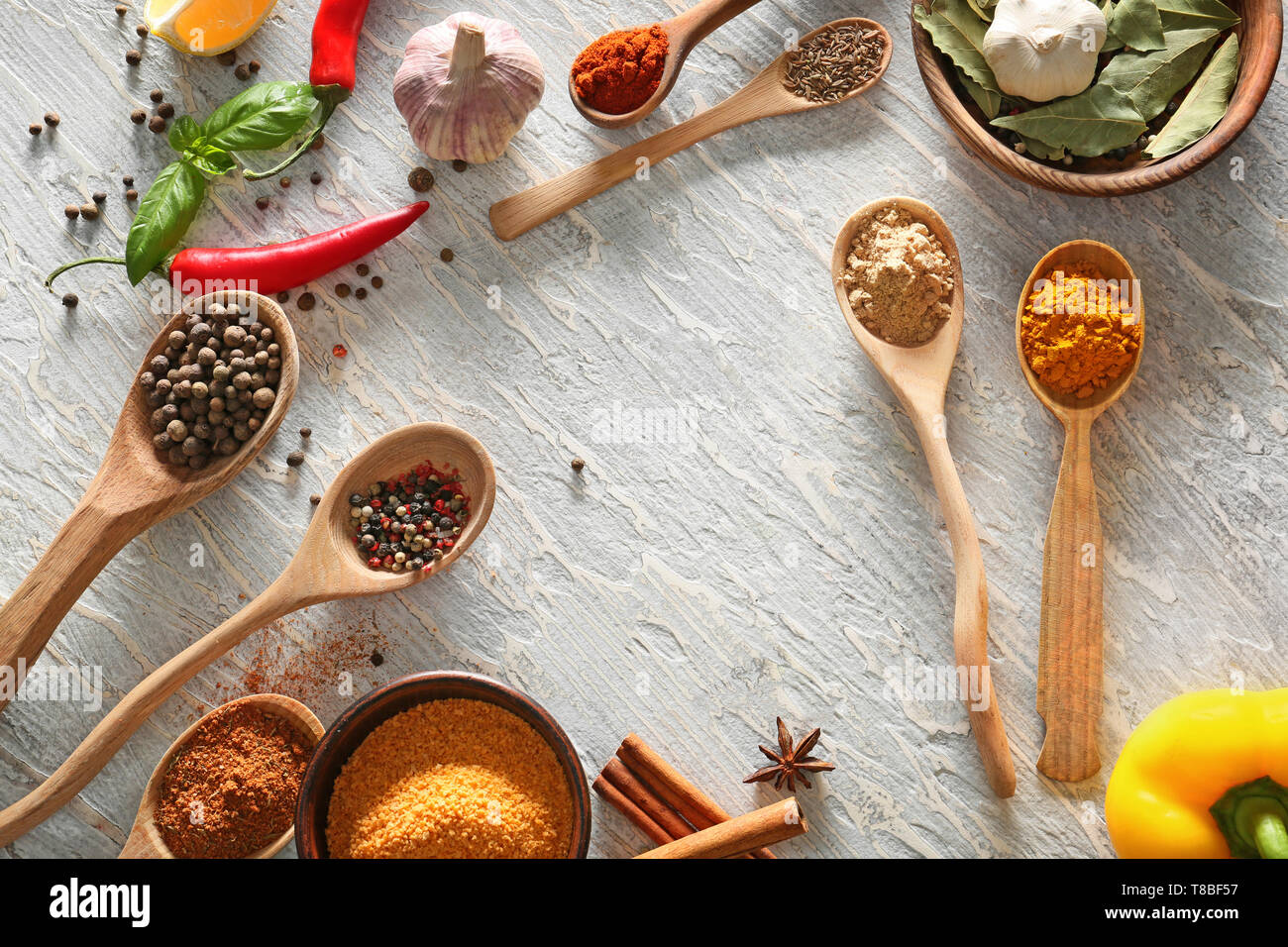 Frame made of different spices on light background Stock Photo - Alamy