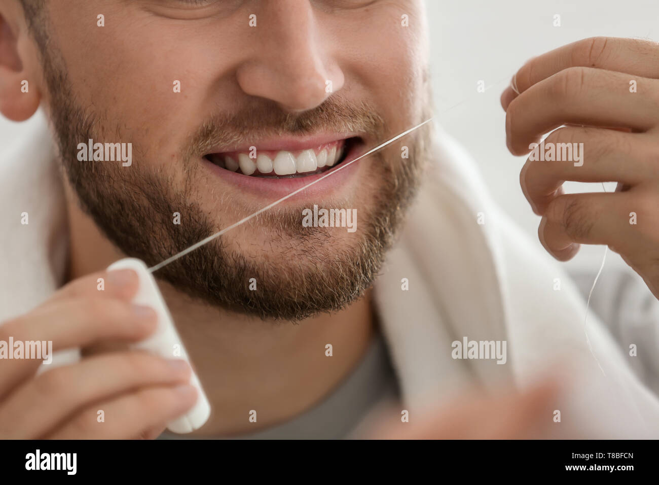 Man flossing teeth hi-res stock photography and images - Alamy