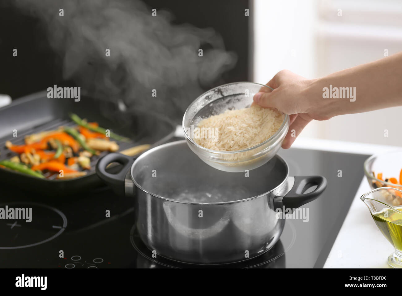 Woman pouring boiling hi-res stock photography and images - Alamy