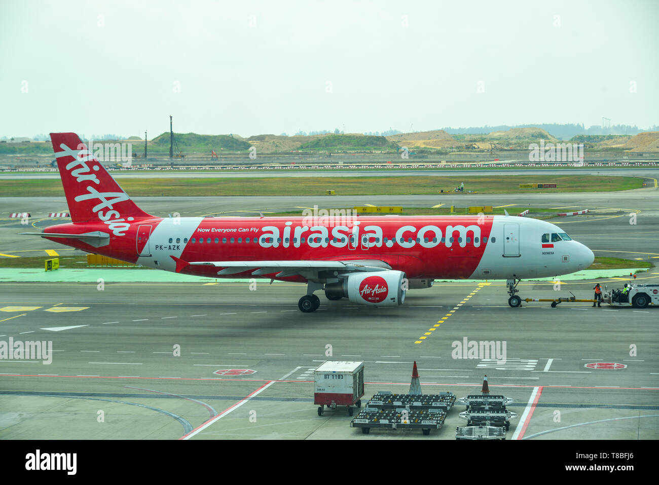 Singapore - Mar 28, 2019. PK-AZK Indonesia AirAsia Airbus A320 taxiing ...