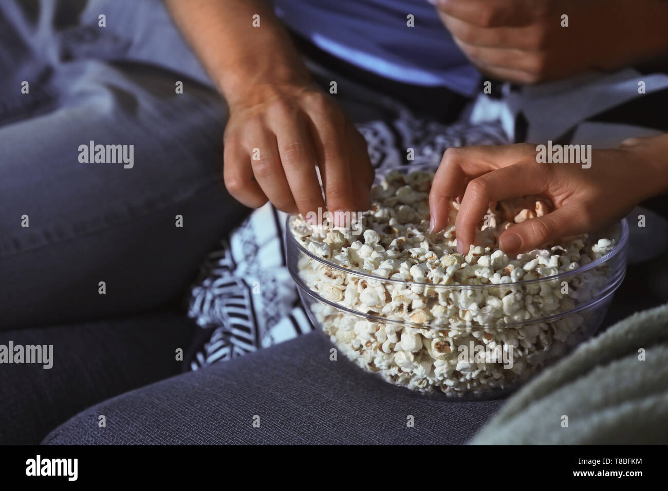 Closeup eating popcorn watching movie hi-res stock photography and ...