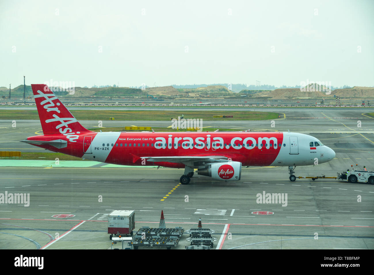 Singapore - Mar 28, 2019. PK-AZK Indonesia AirAsia Airbus A320 taxiing ...