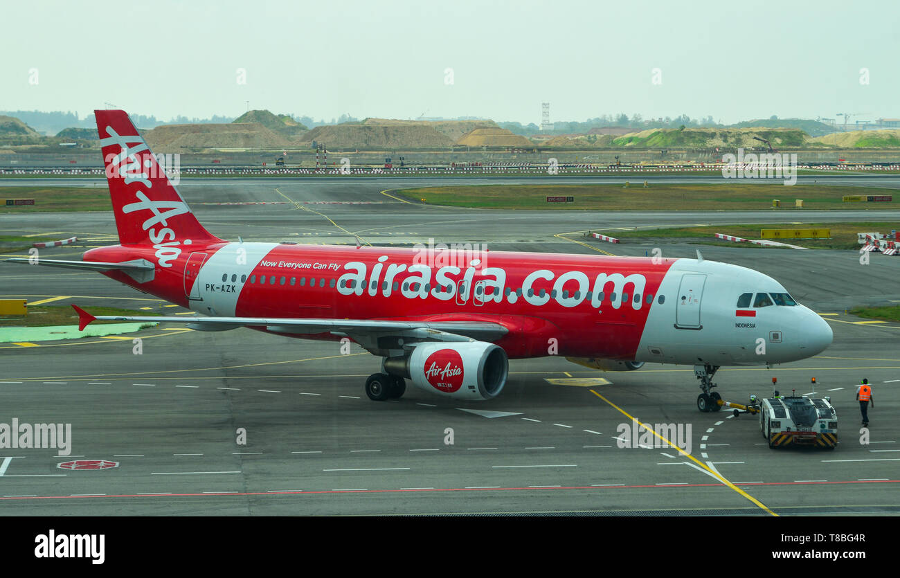 Singapore - Mar 28, 2019. PK-AZK Indonesia AirAsia Airbus A320 taxiing ...