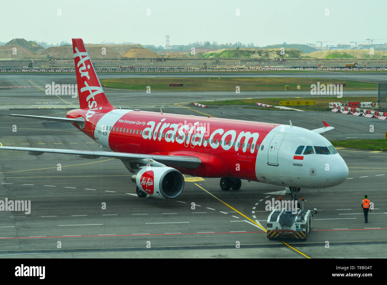 Singapore - Mar 28, 2019. PK-AZK Indonesia AirAsia Airbus A320 taxiing ...