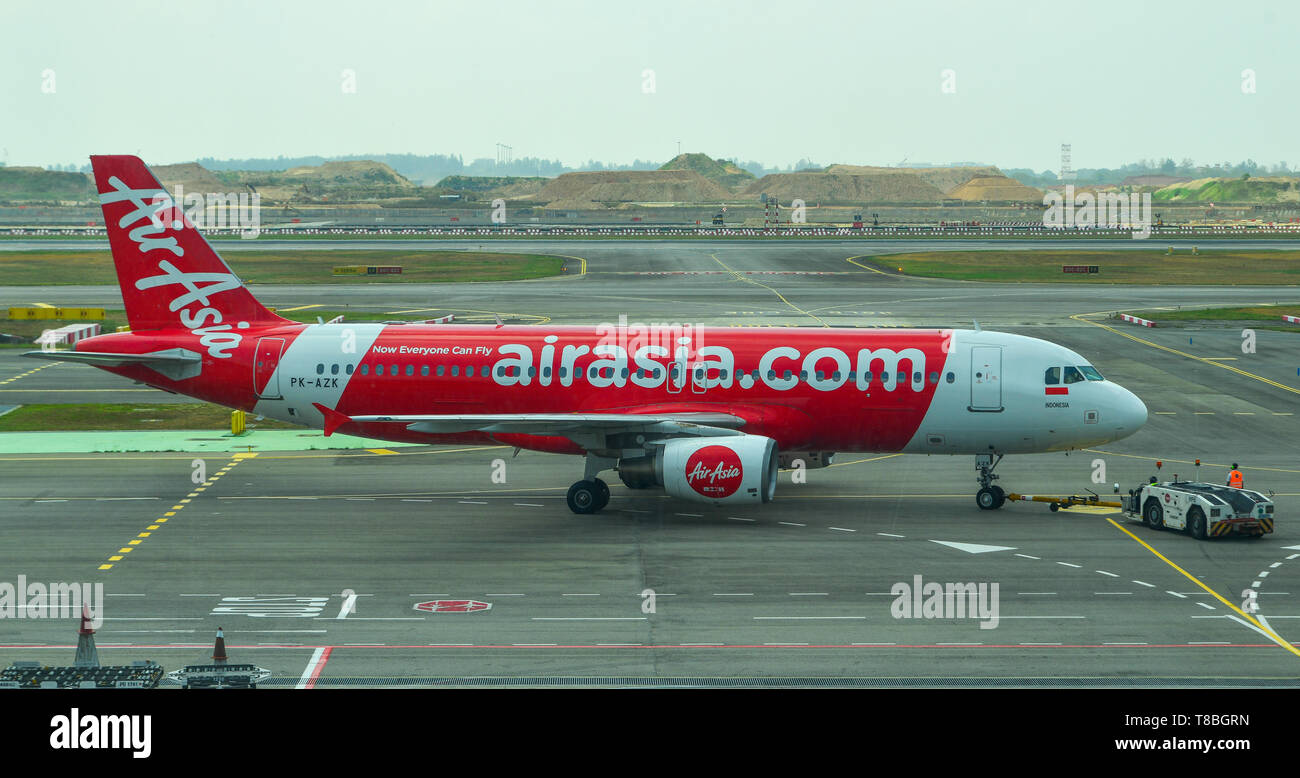 Singapore - Mar 28, 2019. PK-AZK Indonesia AirAsia Airbus A320 taxiing ...