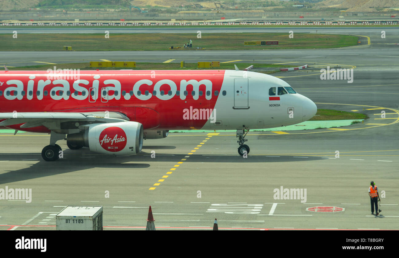 Singapore - Mar 28, 2019. PK-AZK Indonesia AirAsia Airbus A320 taxiing ...