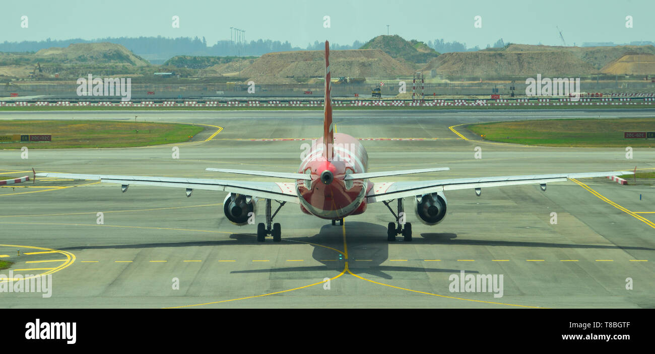 Singapore - Mar 28, 2019. PK-AZK Indonesia AirAsia Airbus A320 taxiing ...