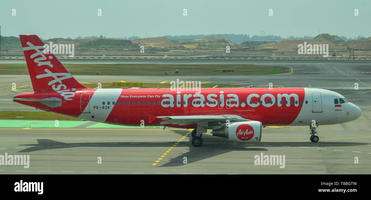 Singapore - Mar 28, 2019. PK-AZK Indonesia AirAsia Airbus A320 taxiing ...