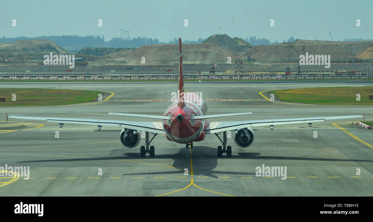 Singapore - Mar 28, 2019. PK-AZK Indonesia AirAsia Airbus A320 taxiing ...