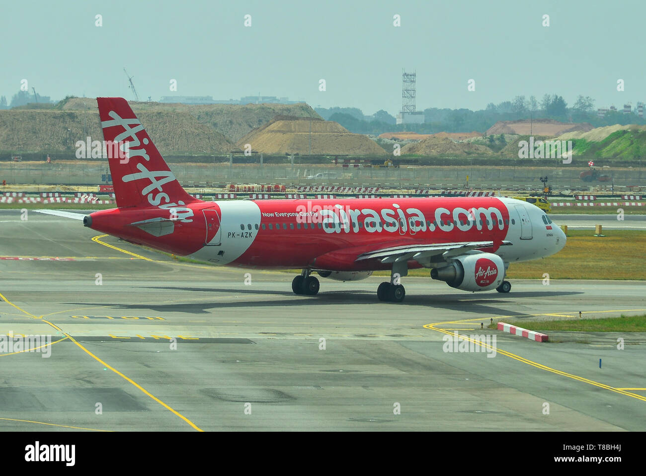 Singapore - Mar 28, 2019. PK-AZK Indonesia AirAsia Airbus A320 taxiing ...