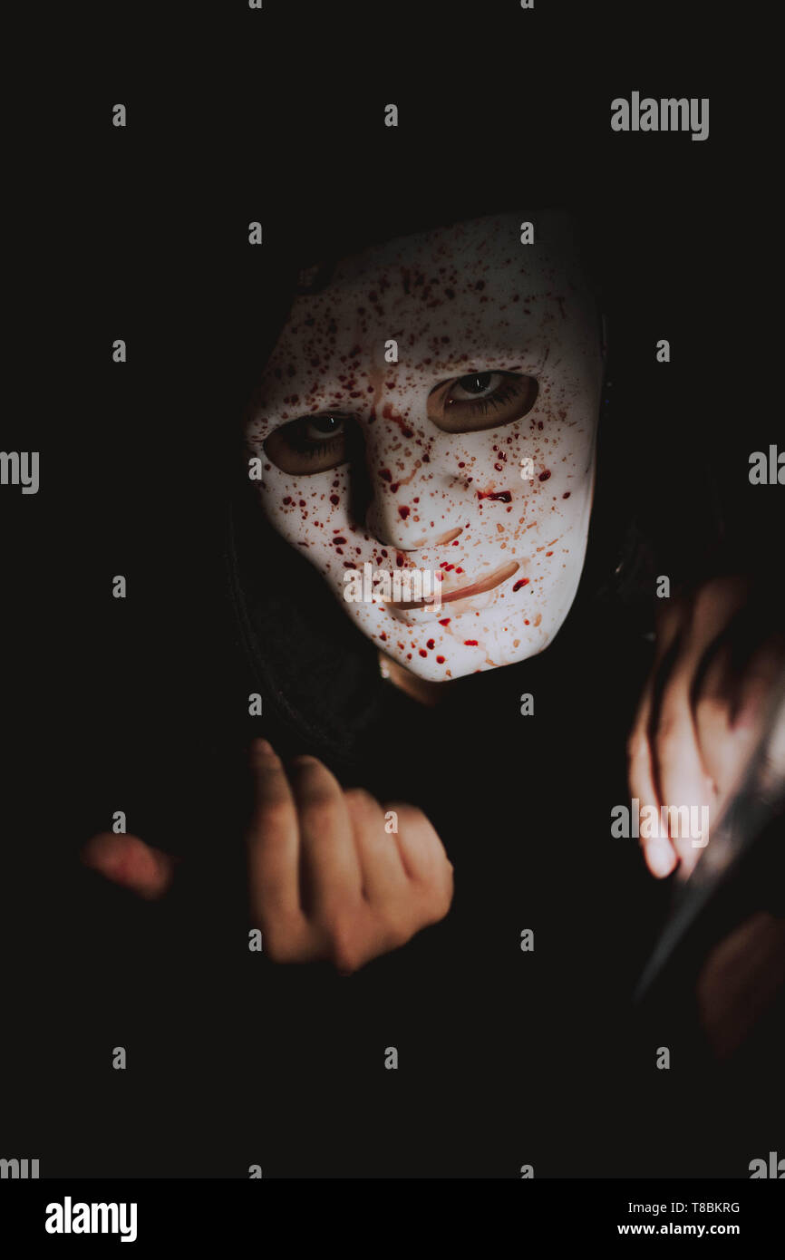 Woman eyes behind mask hi-res stock photography and images - Alamy