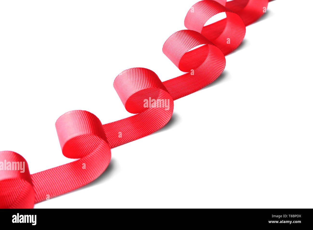 Red ribbon on white background Stock Photo - Alamy