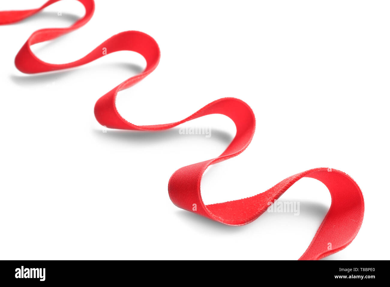 Red ribbon on white background Stock Photo - Alamy