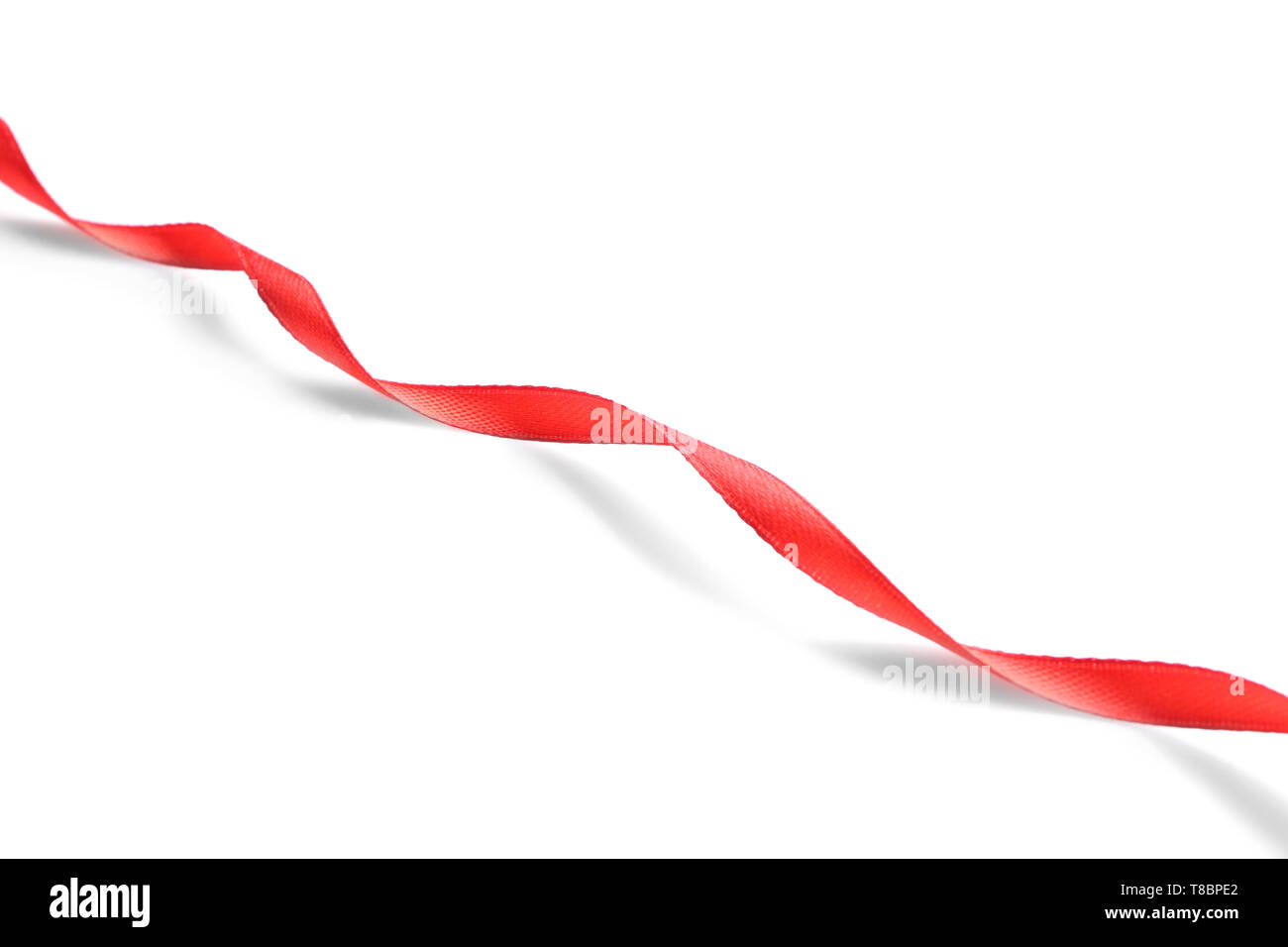 Red ribbon on white background Stock Photo - Alamy