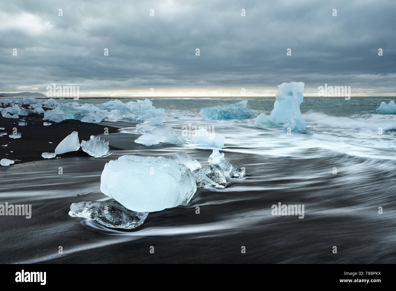 Icy beach in Iceland, Europe. Ice on the black volcanic sand on the ...