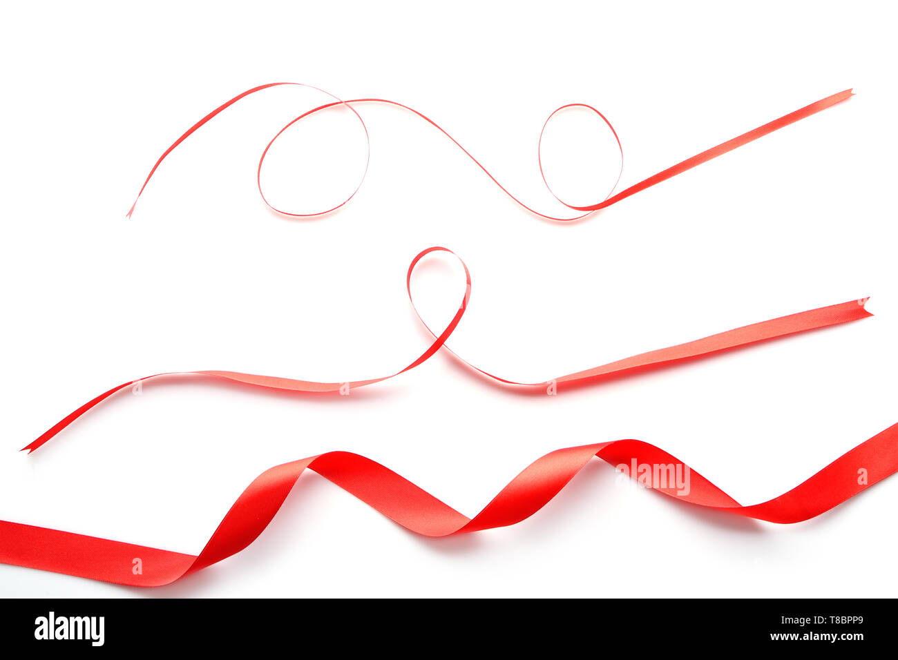 Red ribbons on white background Stock Photo - Alamy