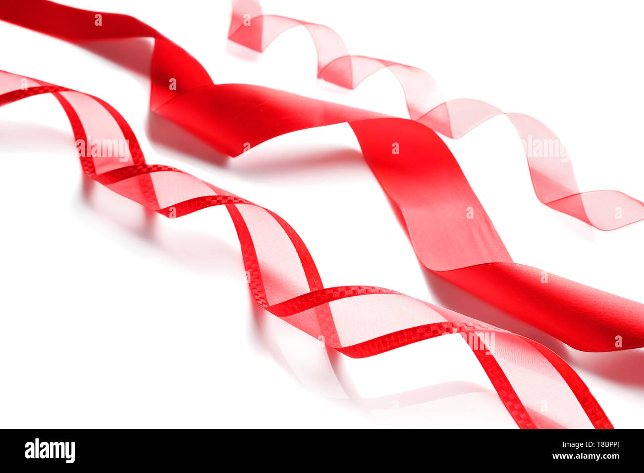 Red ribbons on white background Stock Photo - Alamy