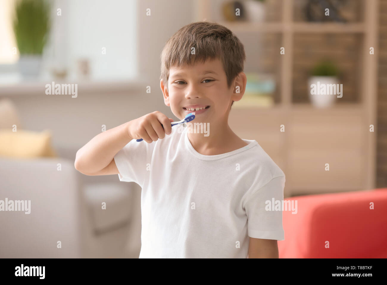 Cute little boy brushing teeth at home Stock Photo - Alamy