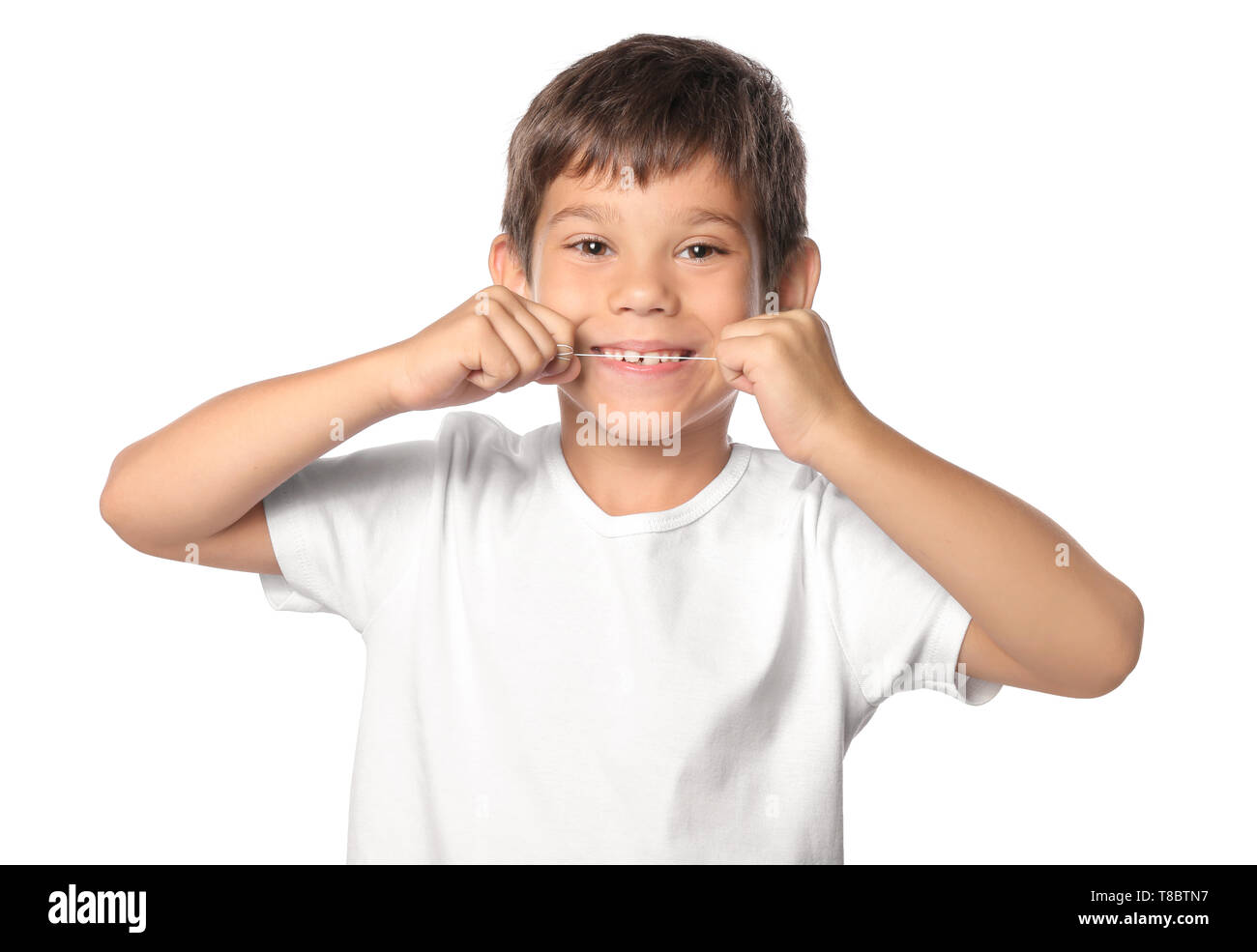 Cute little boy flossing his teeth on white background Stock Photo - Alamy