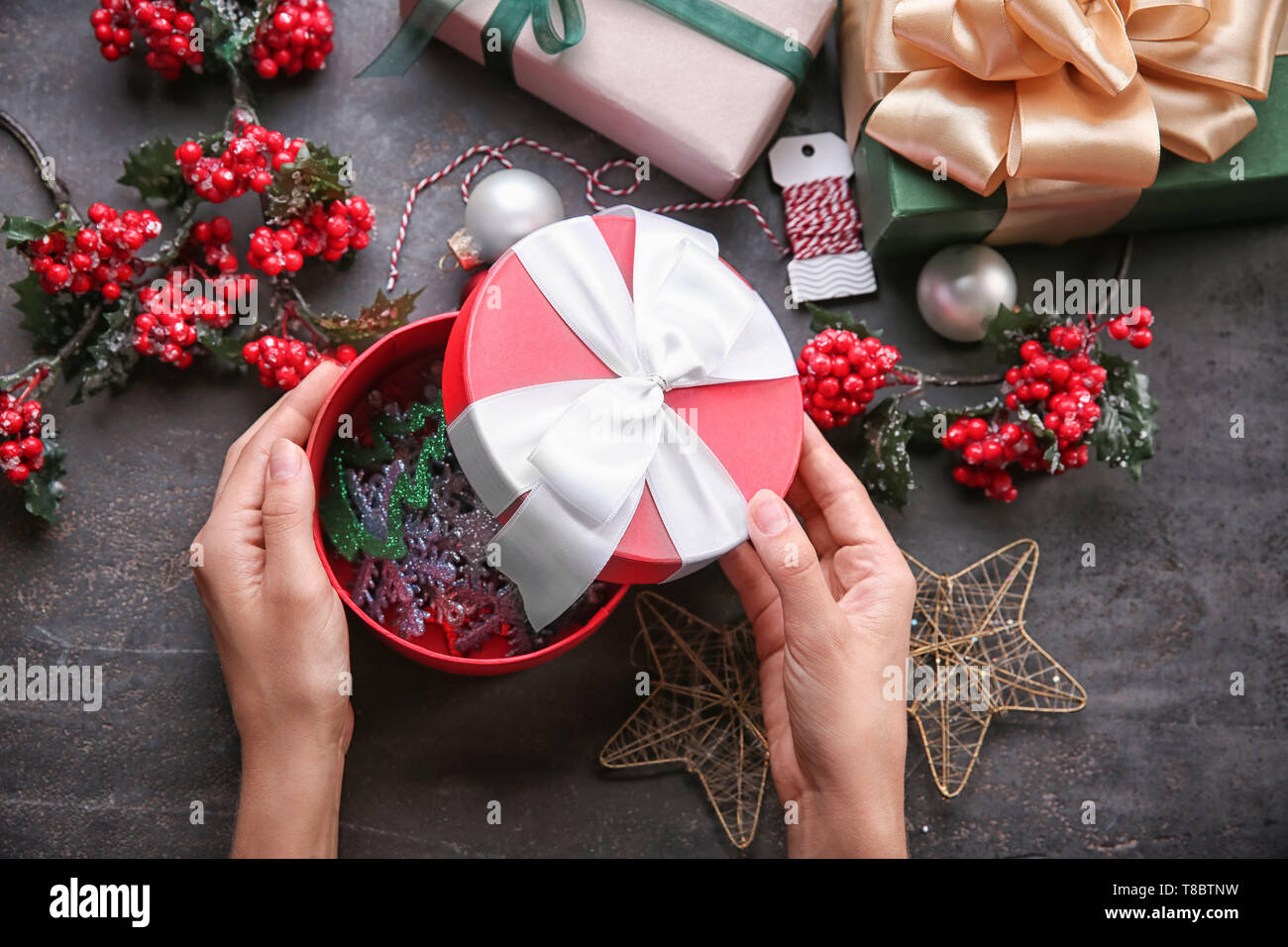 Female hands opening boxes hi-res stock photography and images - Alamy