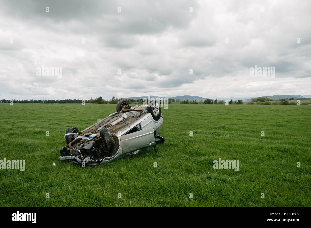 Rolled car on its roof in a farmers field Stock Photo - Alamy