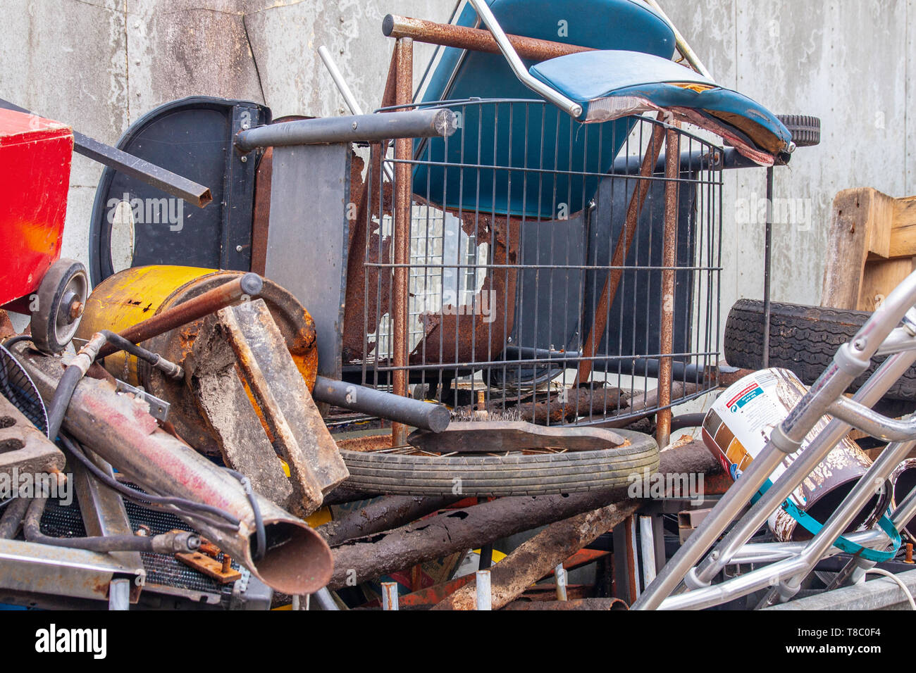 Trash in an alley piled high Stock Photo - Alamy