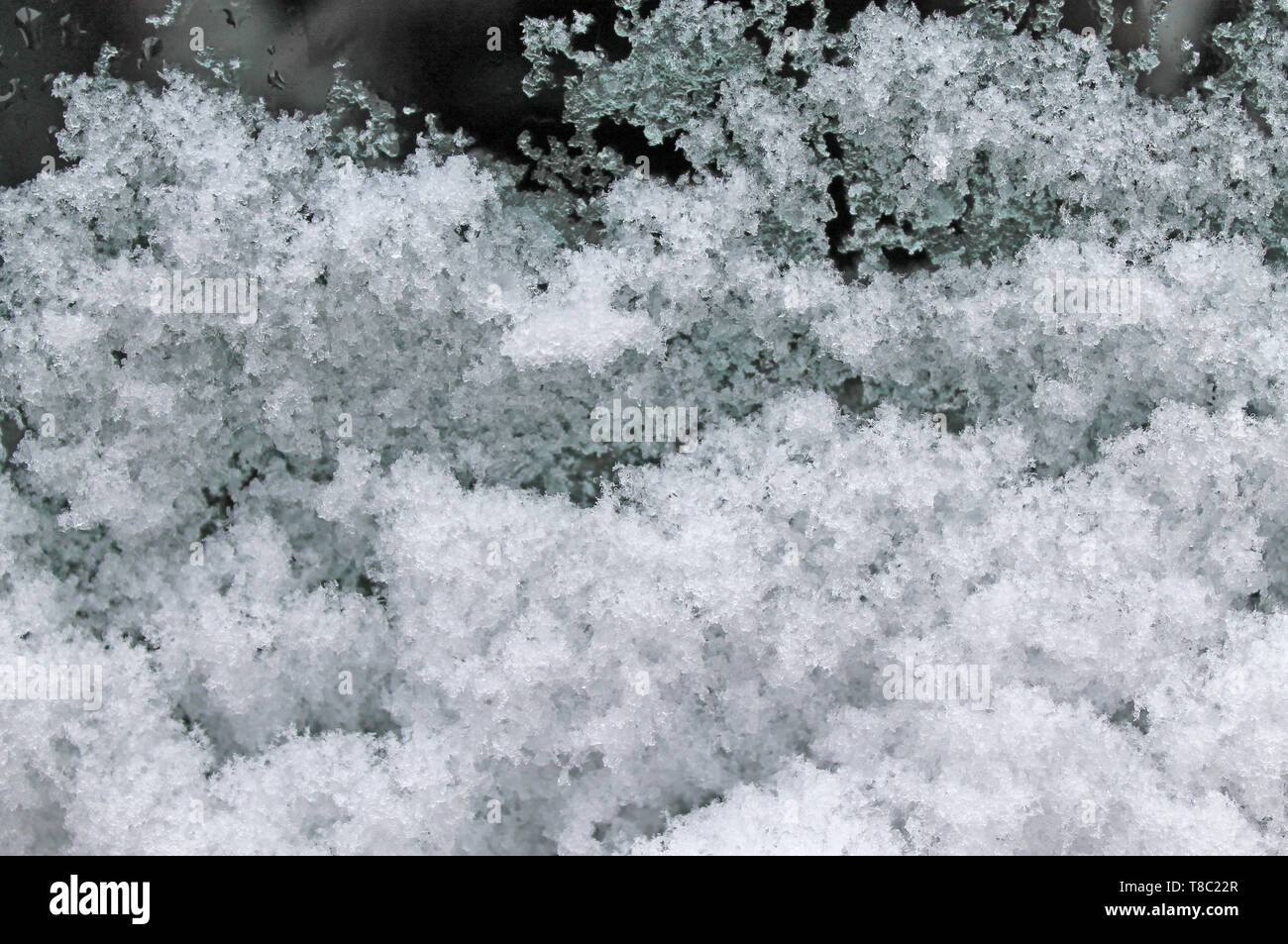 melting snow on the glass. sleet on glass. lace grey texture Stock ...