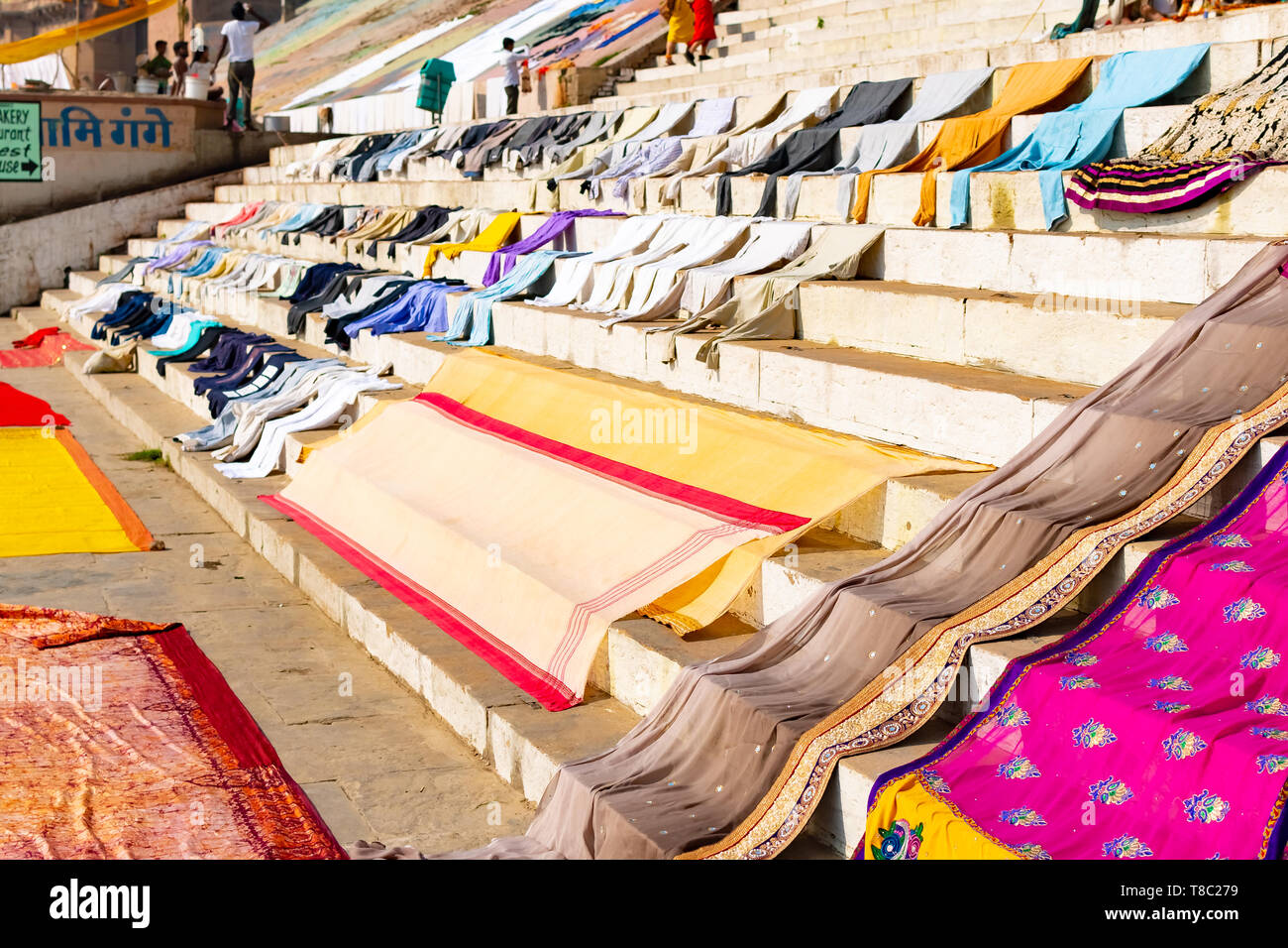 Varanasi, India, Mar 10 2019 - People washing clothes on the ghats of ...